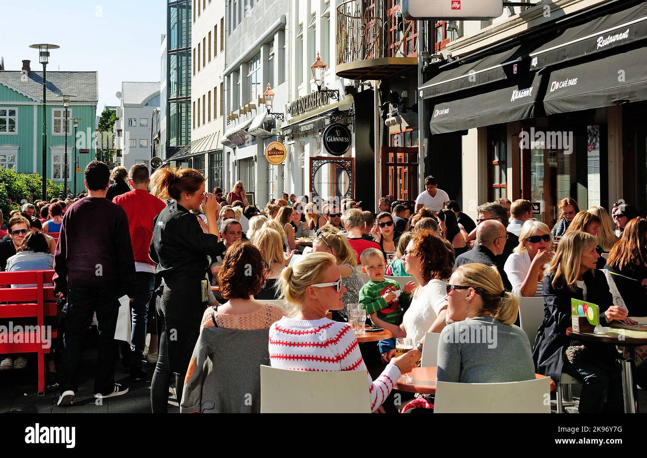 The Icelanders enjoying the good weather in an outdoor cafe in downtown ...