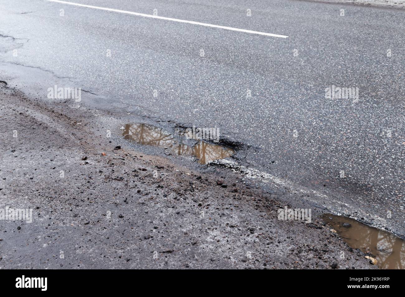 Dirty rural road with puddles and potholes, background photo Stock ...