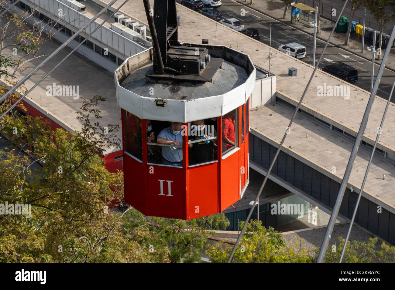 Barcelona cable car in the foreground, going down to the port Stock ...