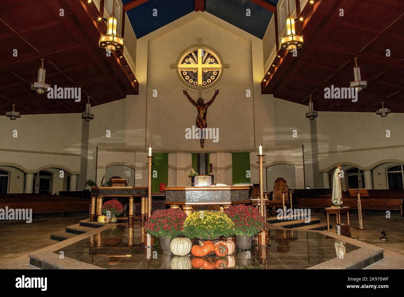 St. Ambrose Catholic Church decorated with fall mums and pumpkins with ...
