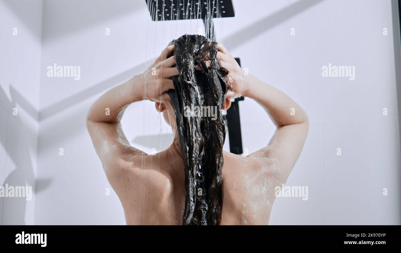 A back view of a Caucasian female taking shower at home Stock Photo - Alamy