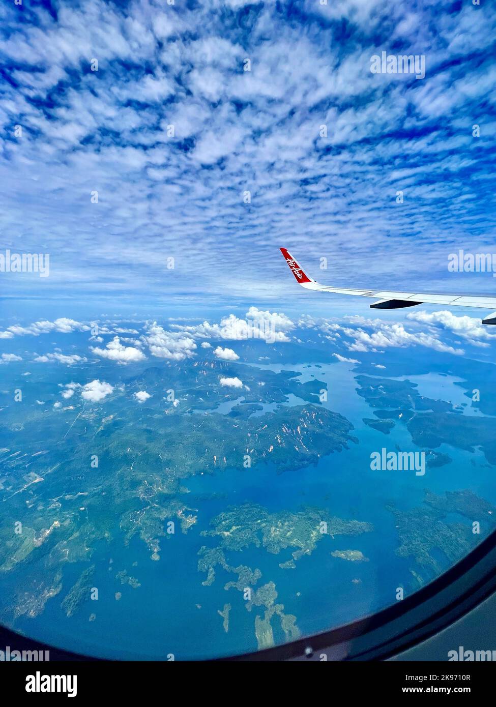 an aerial view over the kenyir lake from air asia flight to KL Stock ...