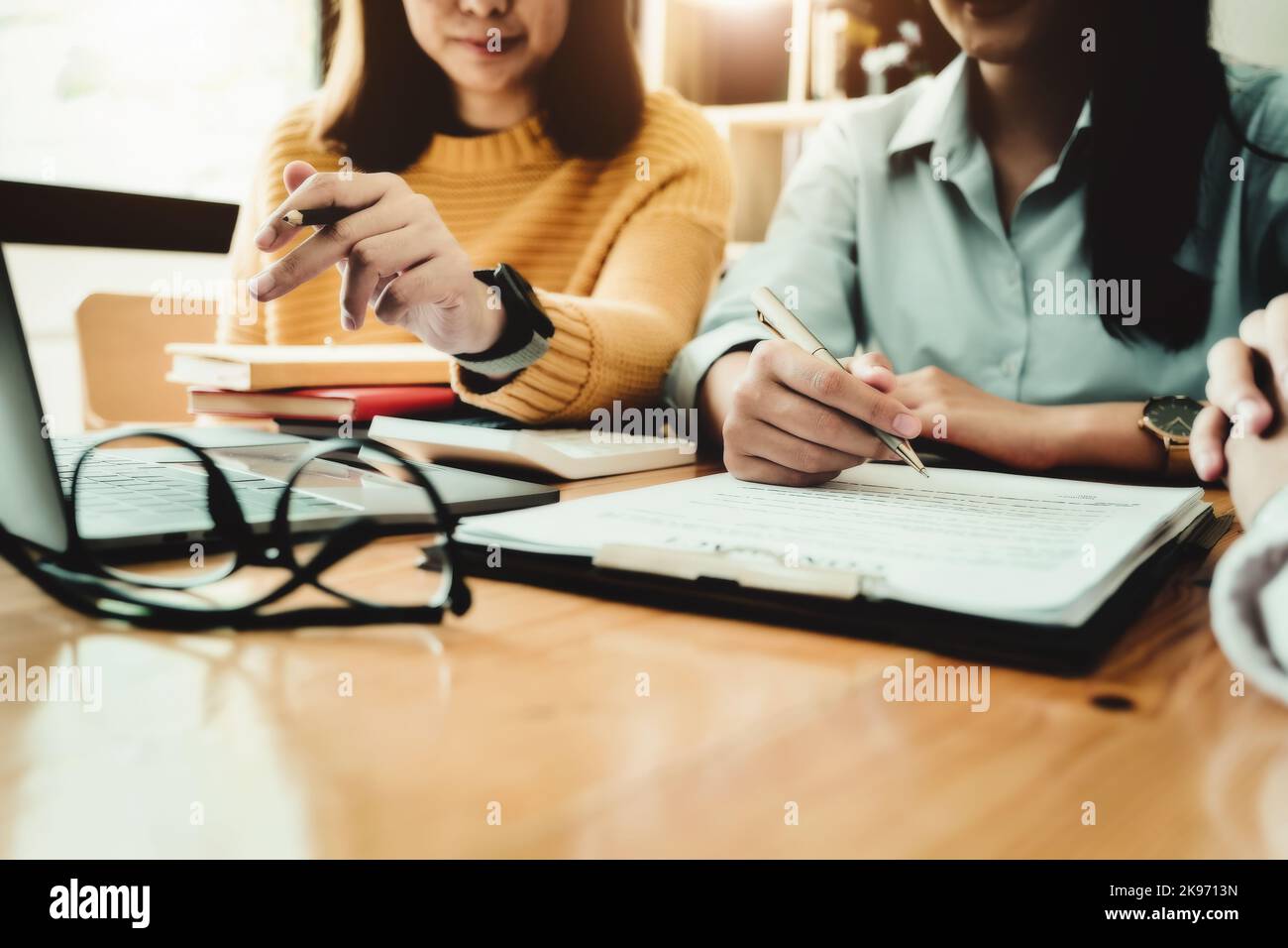 Business owner holding a pen to read the conditions to enter into a ...