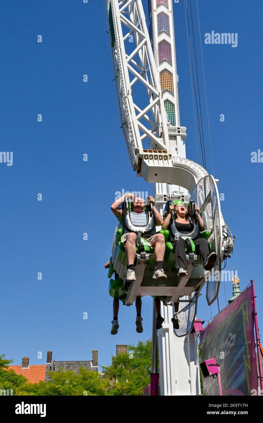 Middleburg, Netherlands - August 2022: People enjoying a ride on a tall ...