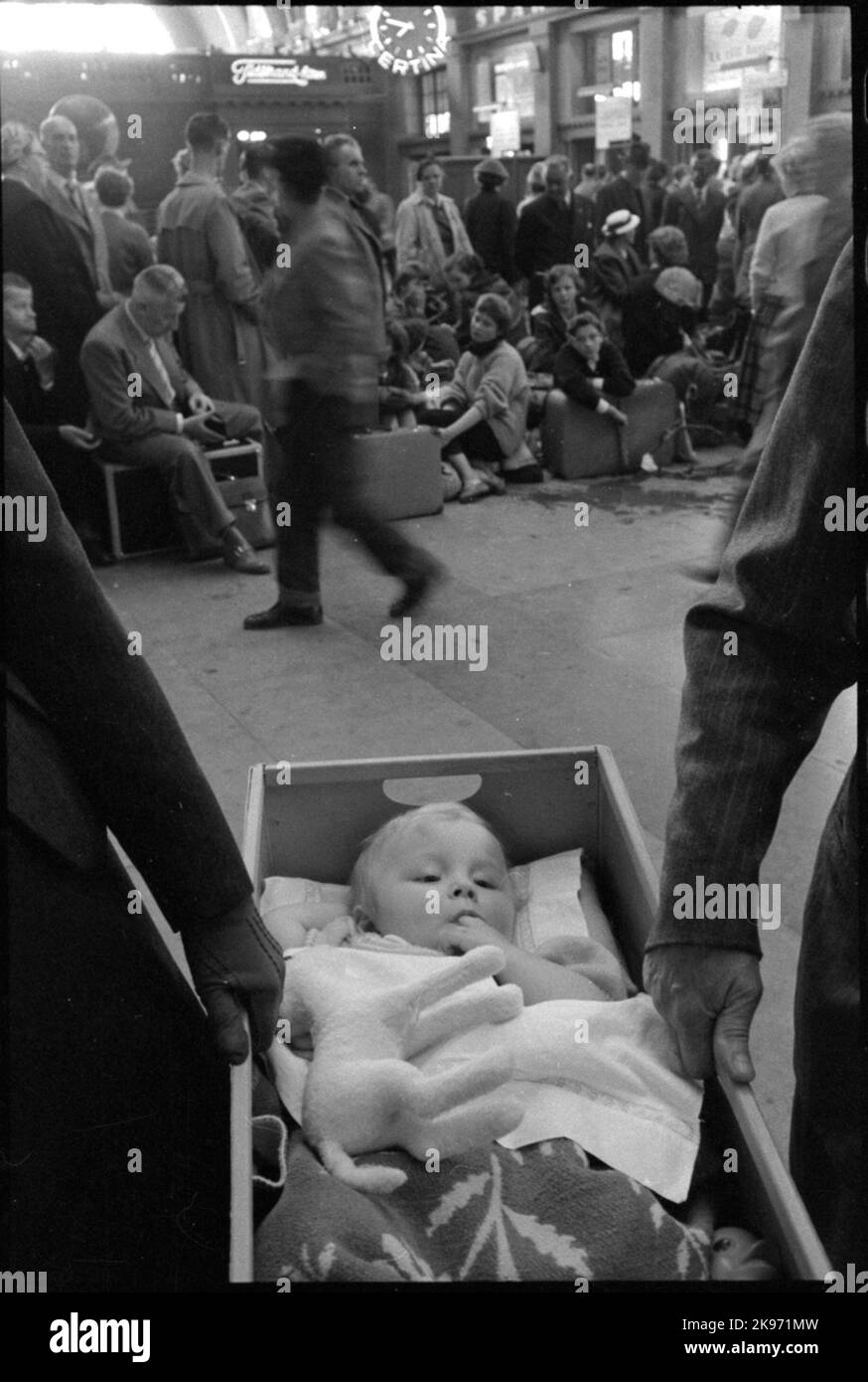 Travelers are waiting for trains. The photo taken at the height of the ...