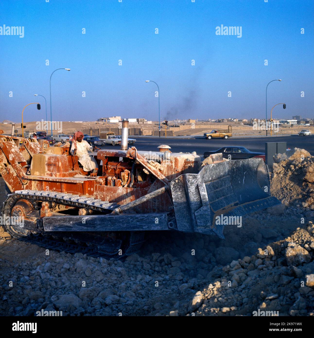 Saudi Arabia Construction Worker In Bulldozer Moving Rubble Stock Photo ...