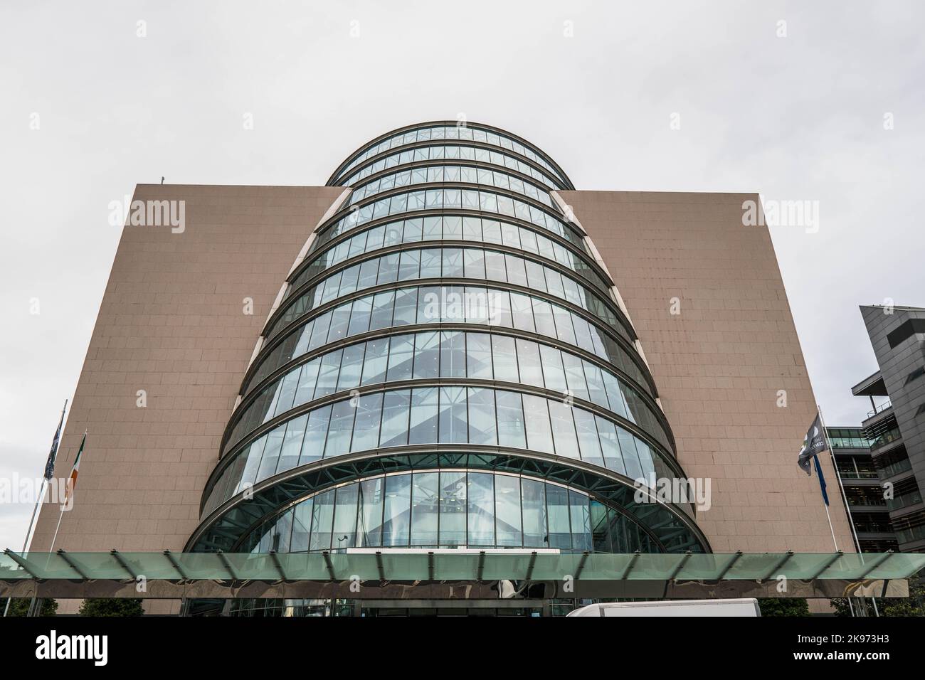 The front view of the round glass building of the Convention Center in ...