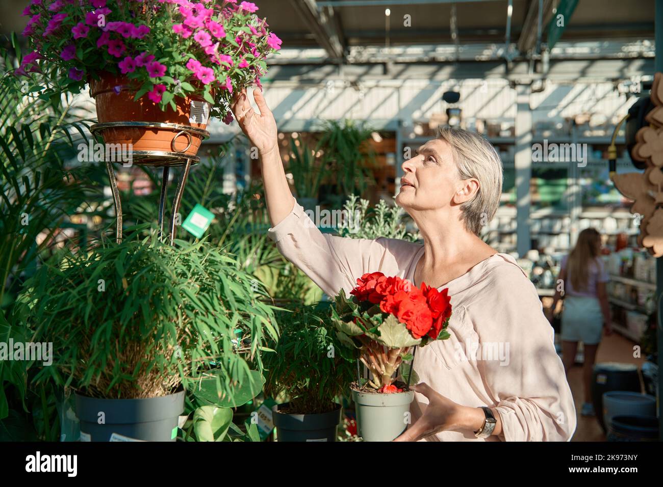 Joyful mature woman in floral hi-res stock photography and images - Alamy