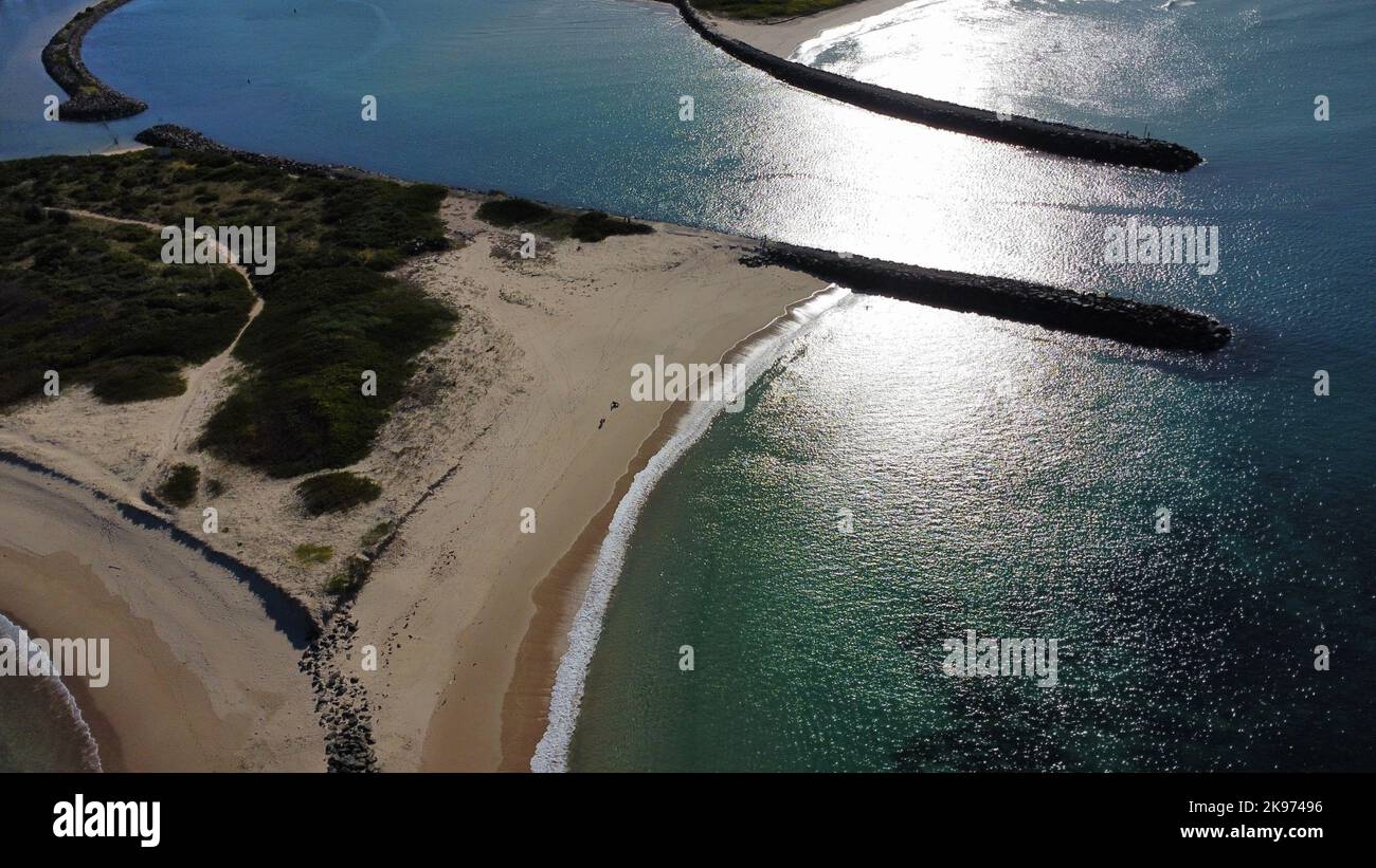An aerial shot of the turquoise water and the sandy Warilla beach in ...