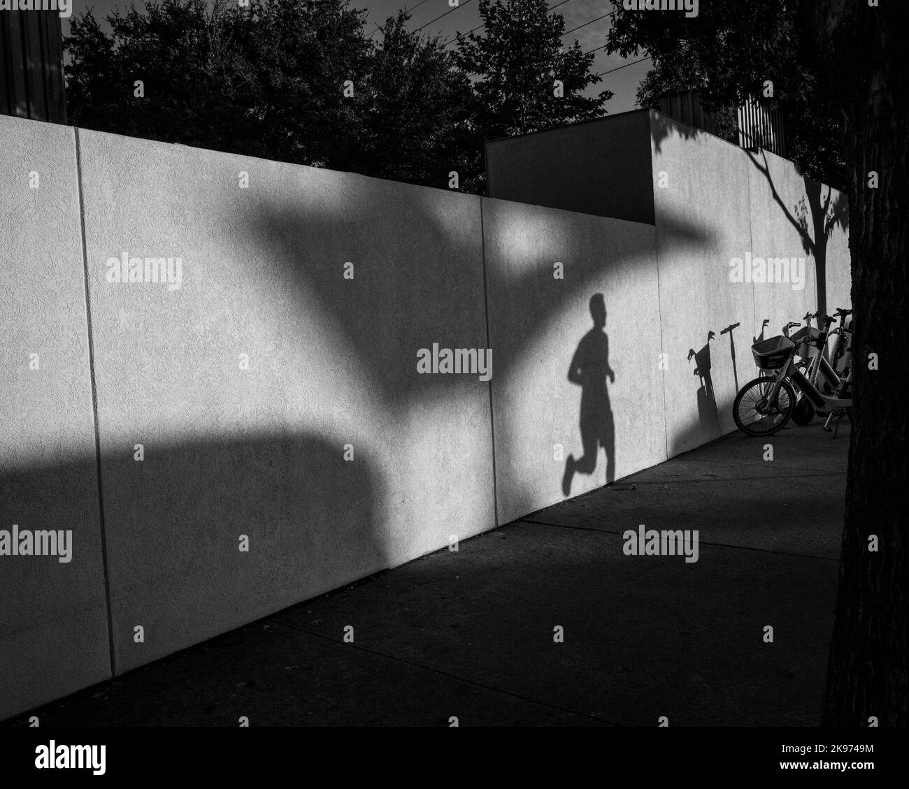 Shadow man running on street Black and White Stock Photos & Images - Alamy