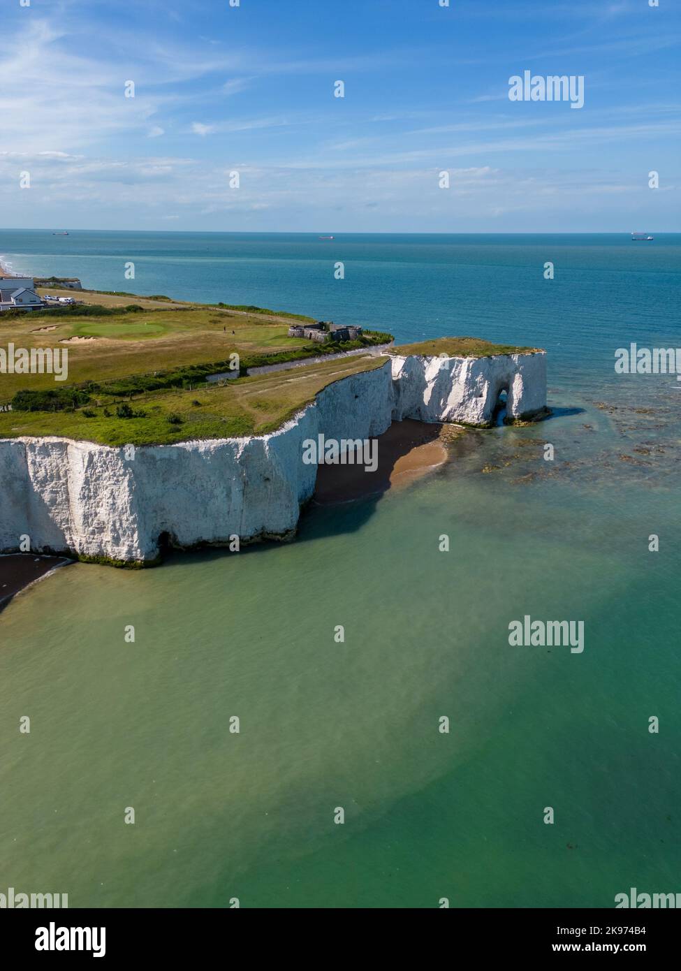 The beautiful white chalk cliff against the blue sky in Kingsgate Bay ...