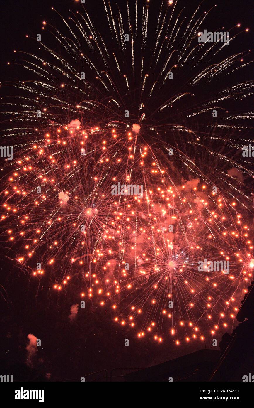 A night sky with red glowing fireworks - concept of celebration and ...