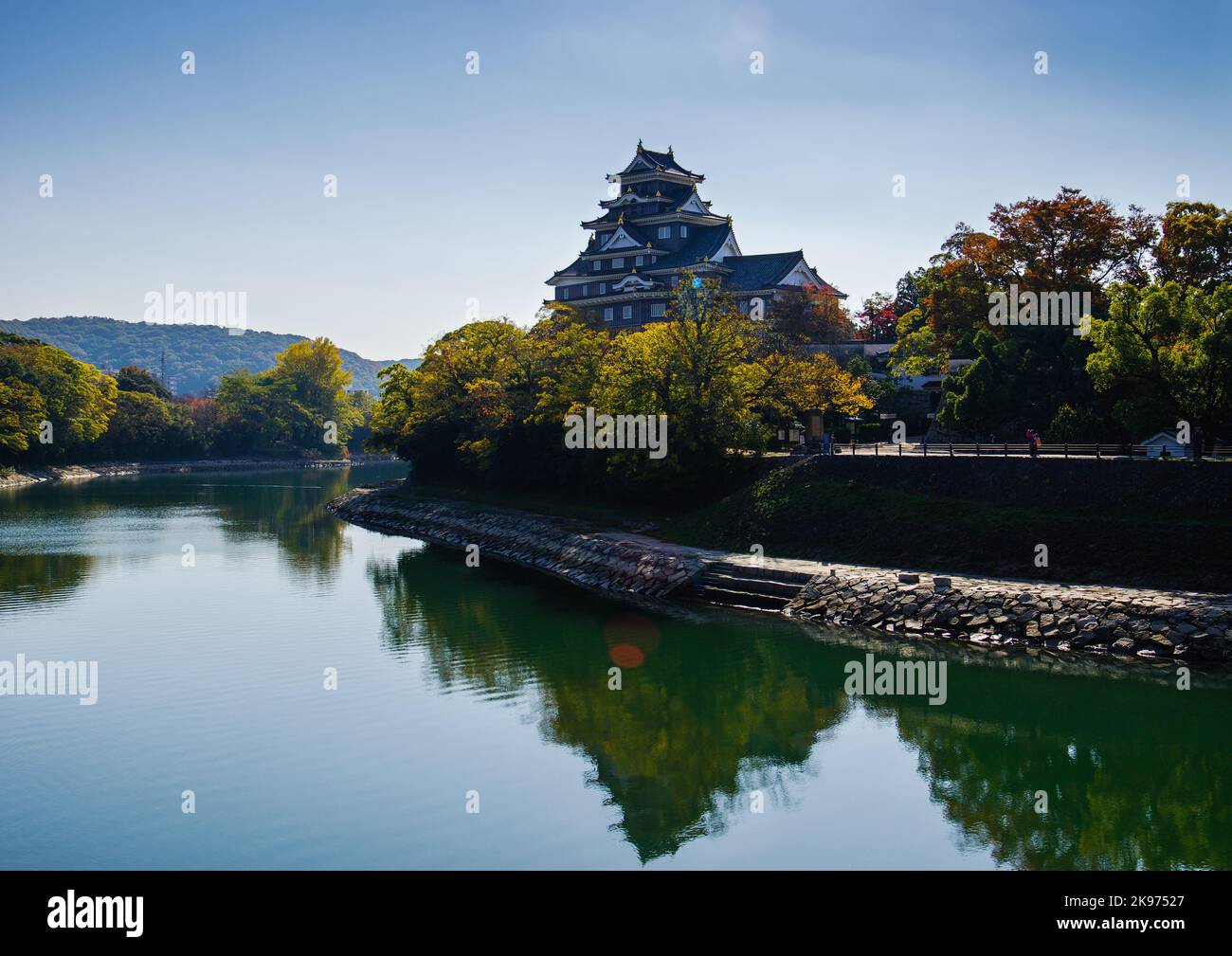 A river view with the Okayama Castle in the background in Japan Stock ...
