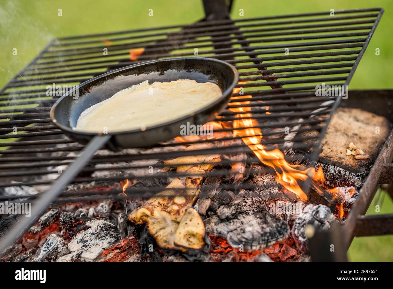 A beautiful shot of making pancakes on charcoal fire Stock Photo - Alamy