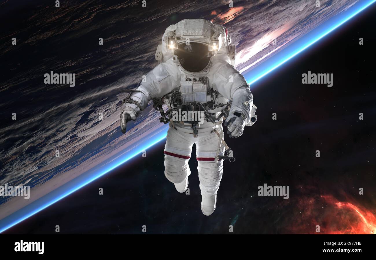 Astronaut in outer space orbiting Earth. Solar system Stock Photo - Alamy