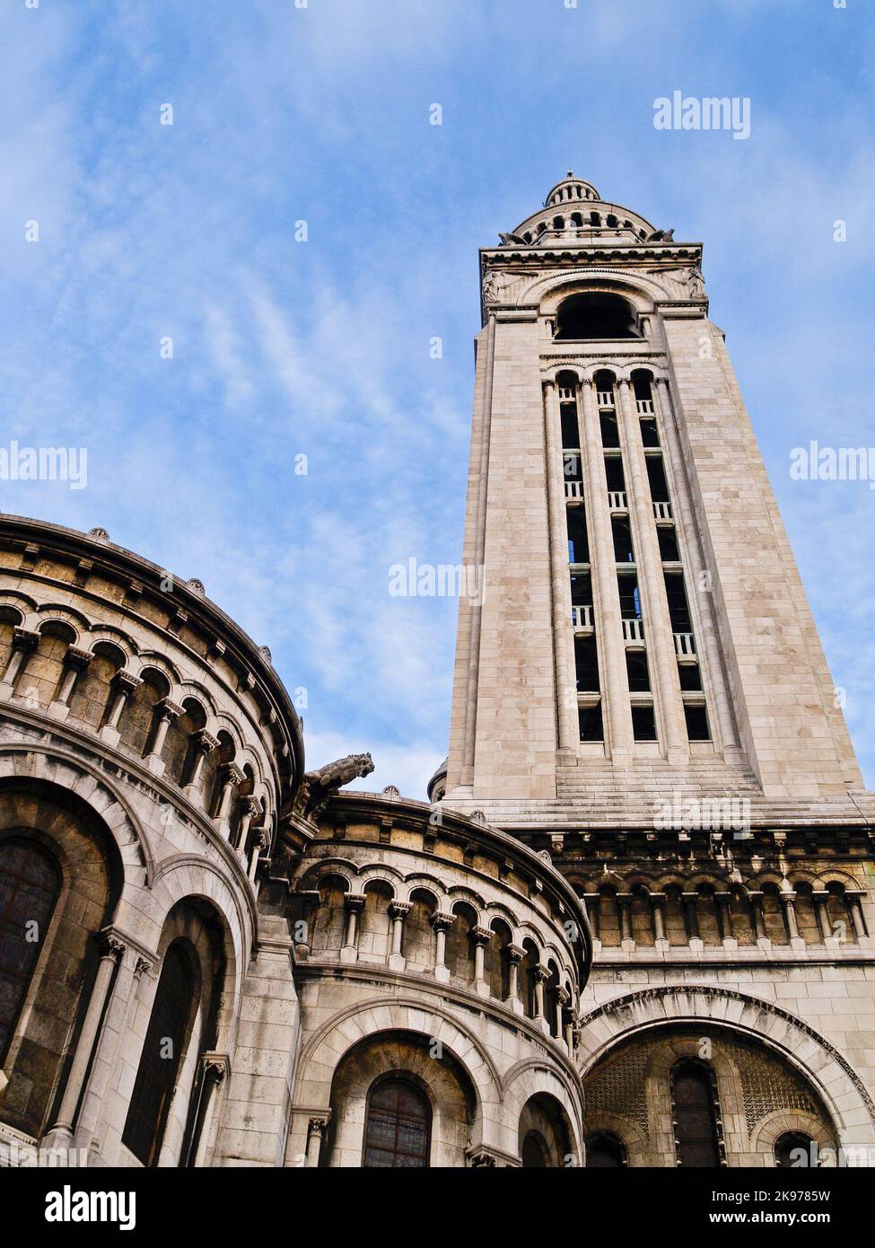 Tall tower rising skyward from building below, in Paris France Stock ...