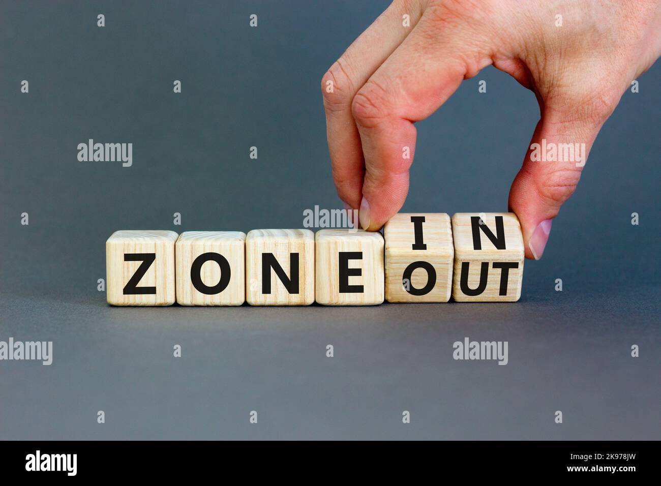 Zone in or out symbol. Concept words Zone in and Zone out on wooden ...