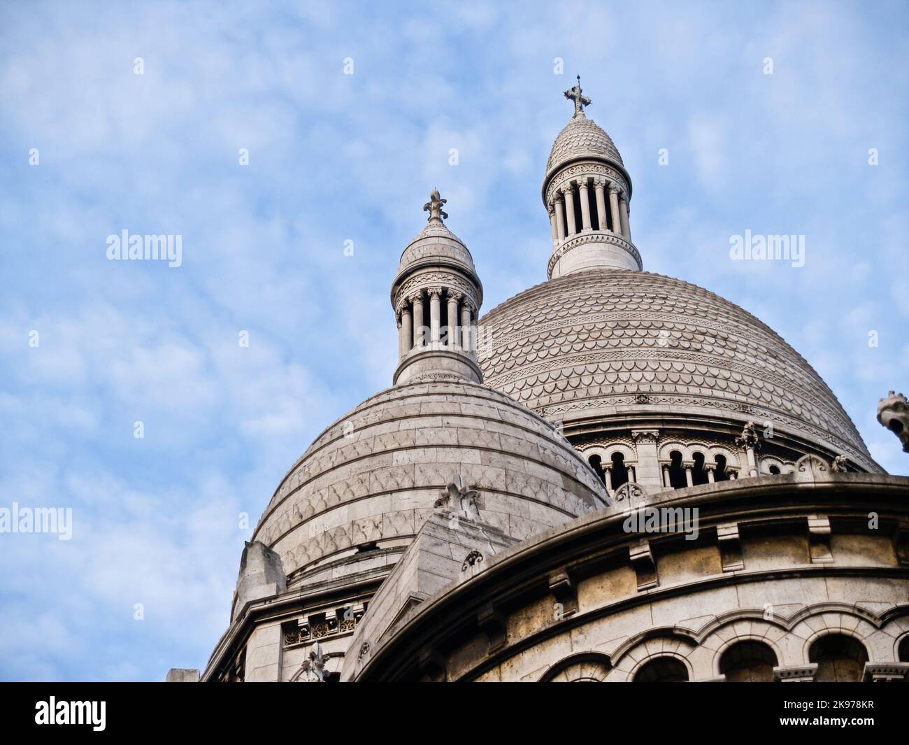 Church domes with intricate detail under blue sky with light clouds in ...