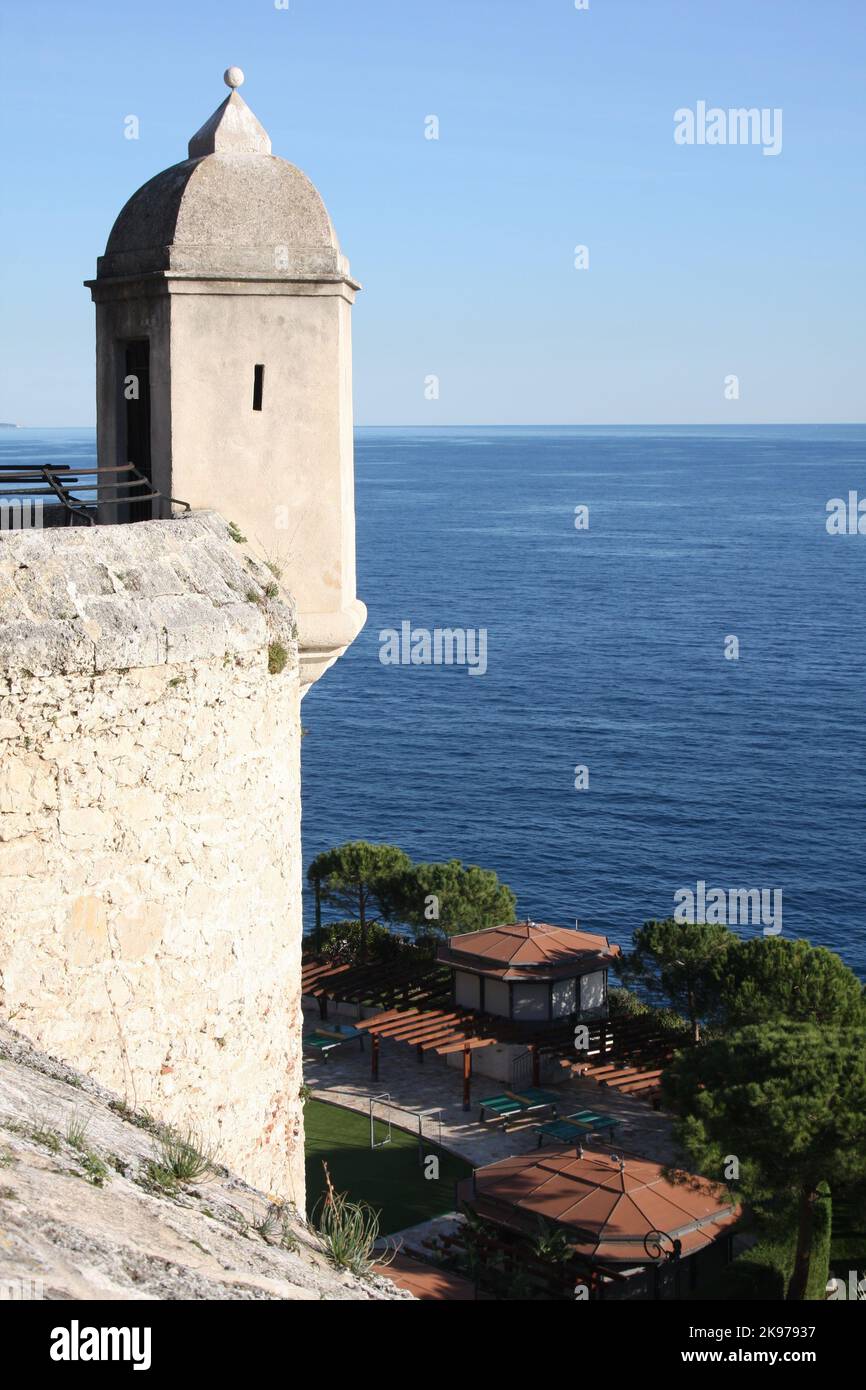 A vertical of a watchtower and the Mediterranean sea in Monte Carlo ...