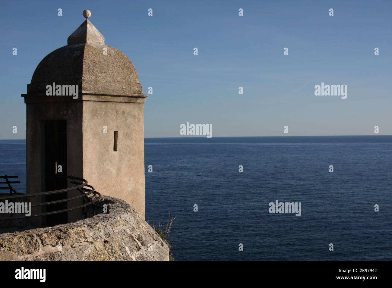 A vertical of a watchtower and the Mediterranean sea in Monte Carlo ...