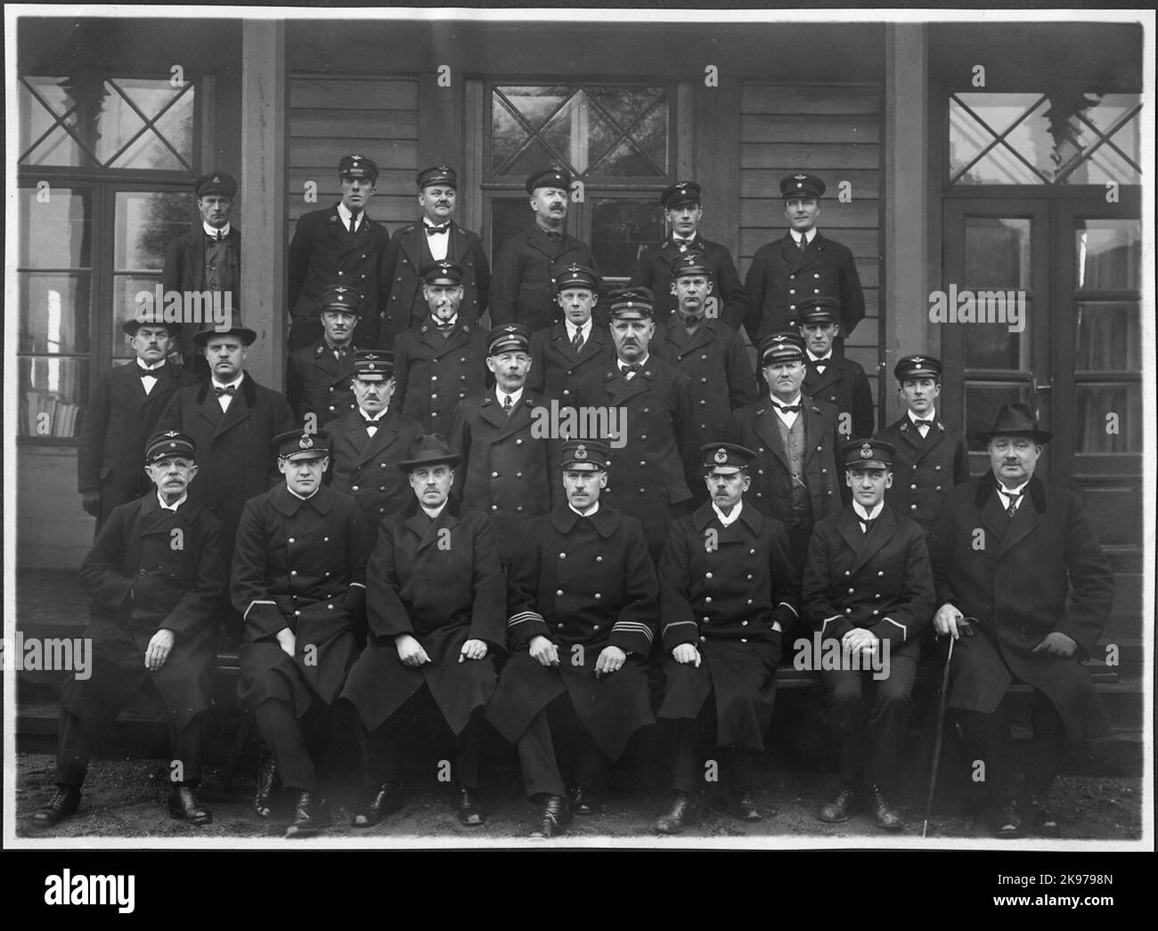 Uniformed staff in front of the station house at Stockholm Södra ...