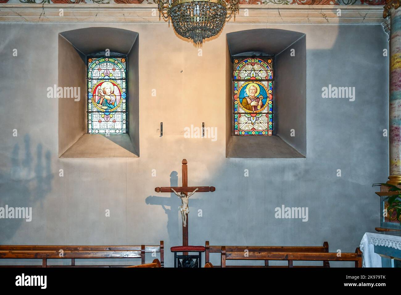 Inside the Church of St Michel with a pair of colorful stained-glass ...