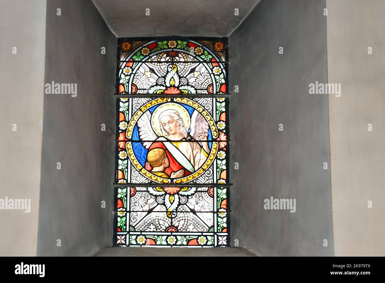 Detail of a colorful stained-glass window inside the Church of St ...