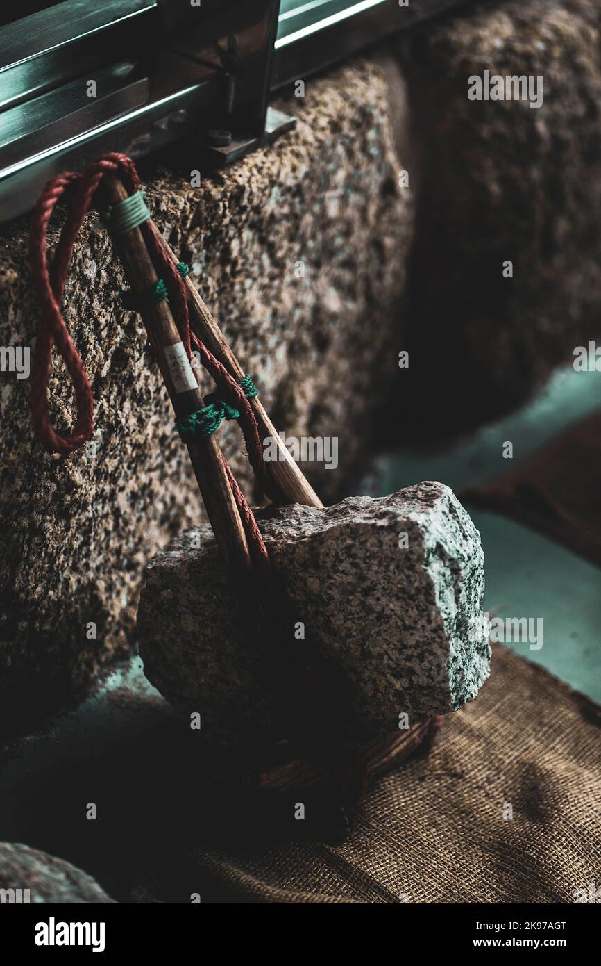 An old vintage stone hammer in display Stock Photo - Alamy