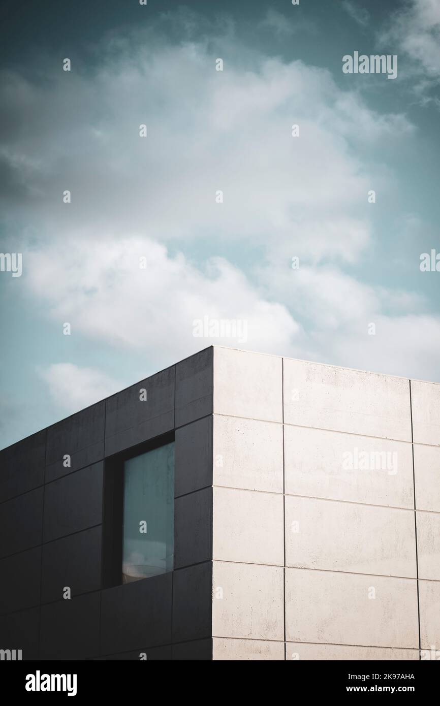 A modern house with window and cloudy sky above Stock Photo - Alamy