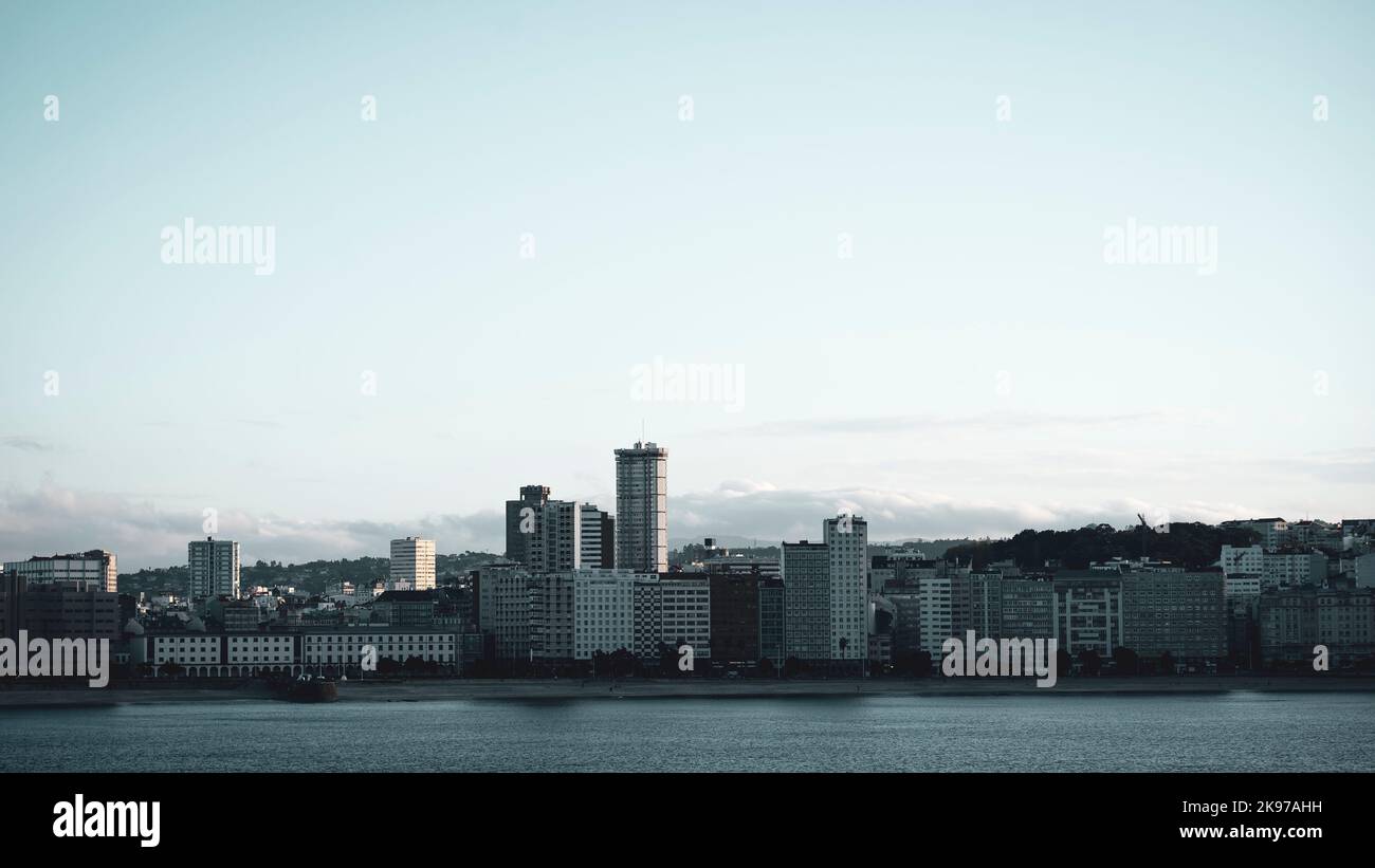 The tall city buildings near the ocean on a sunset afternoon Stock ...