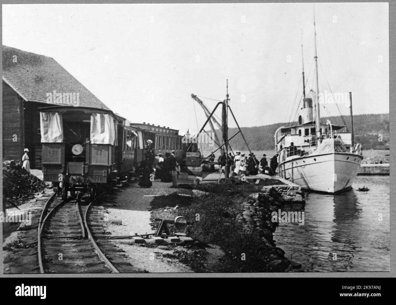 Passenger trains with summer cars at Hästholmen harbor Stock Photo - Alamy