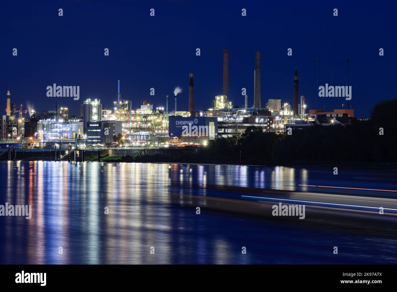 Leverkusen, Germany. 26th Oct, 2022. A ship sails past the Bayer Group ...