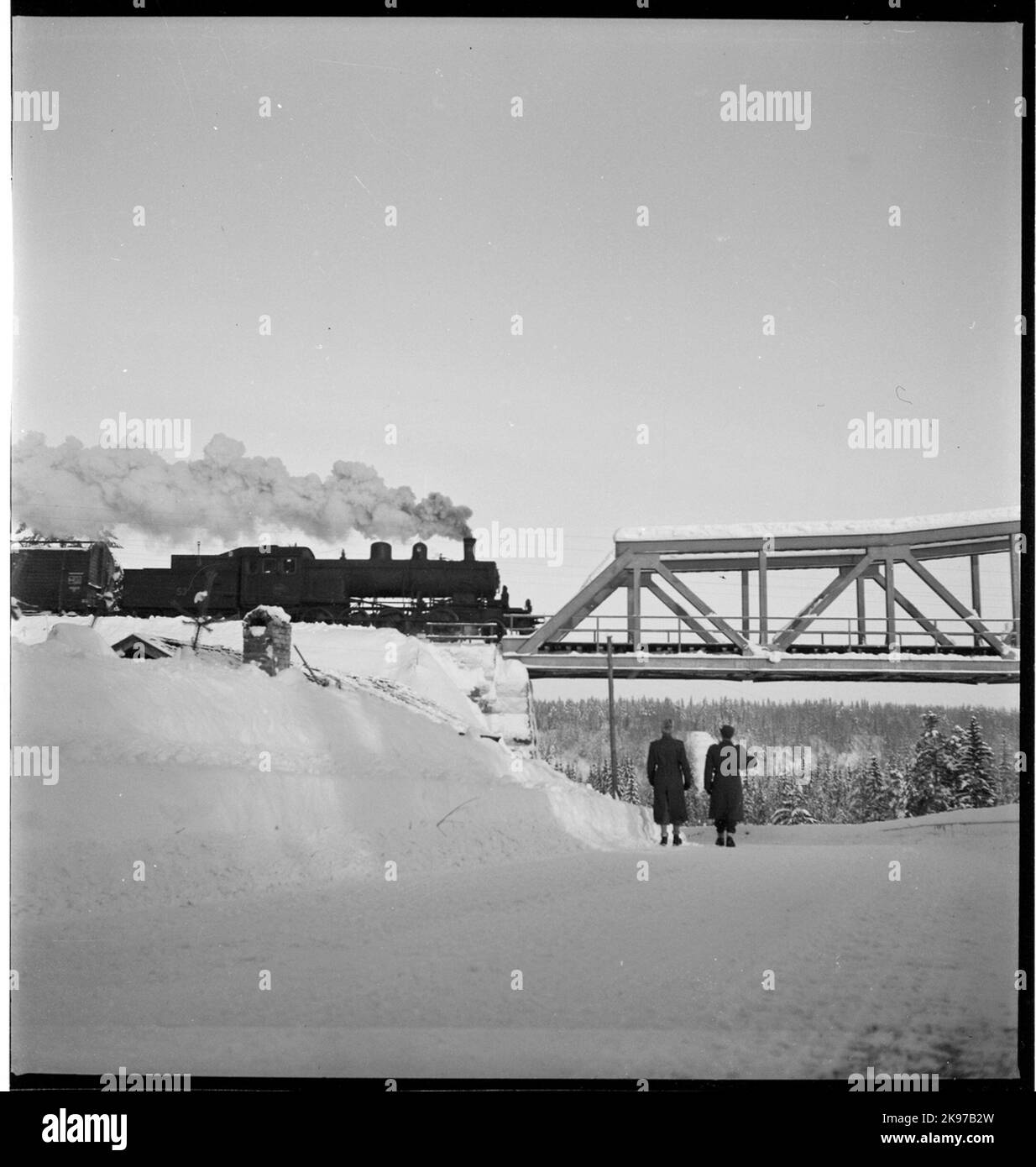 Steam locomotives pass over bridge Stock Photo - Alamy