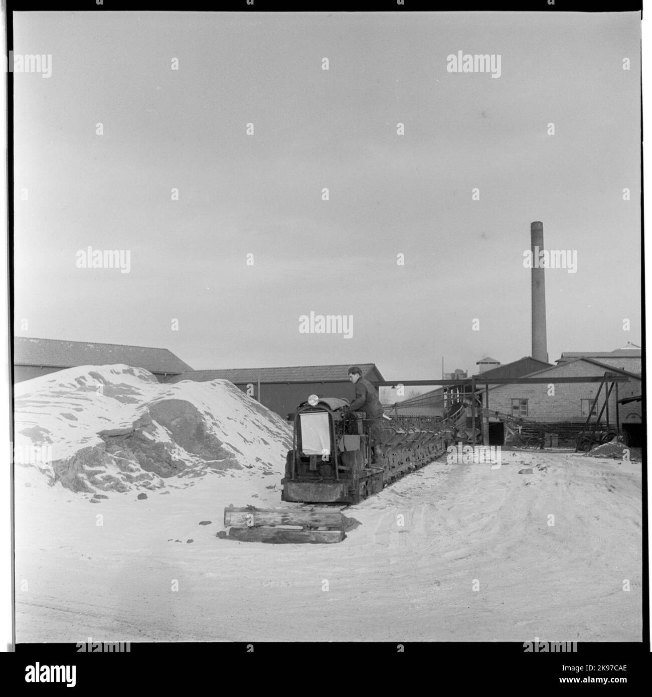 A petrol locomotive with freight wagons at a mine Stock Photo - Alamy