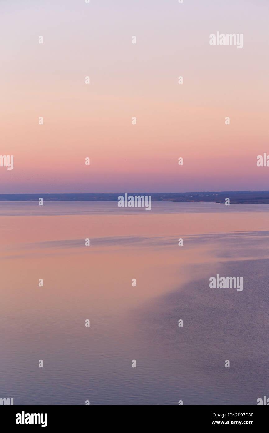 Stunning pink sunset over the lake, sunset background. Khadzhibey ...