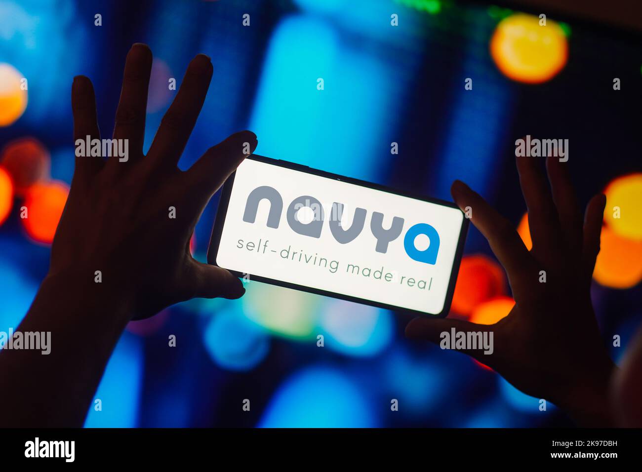 In this photo illustration, the Navya logo is displayed on a smartphone ...