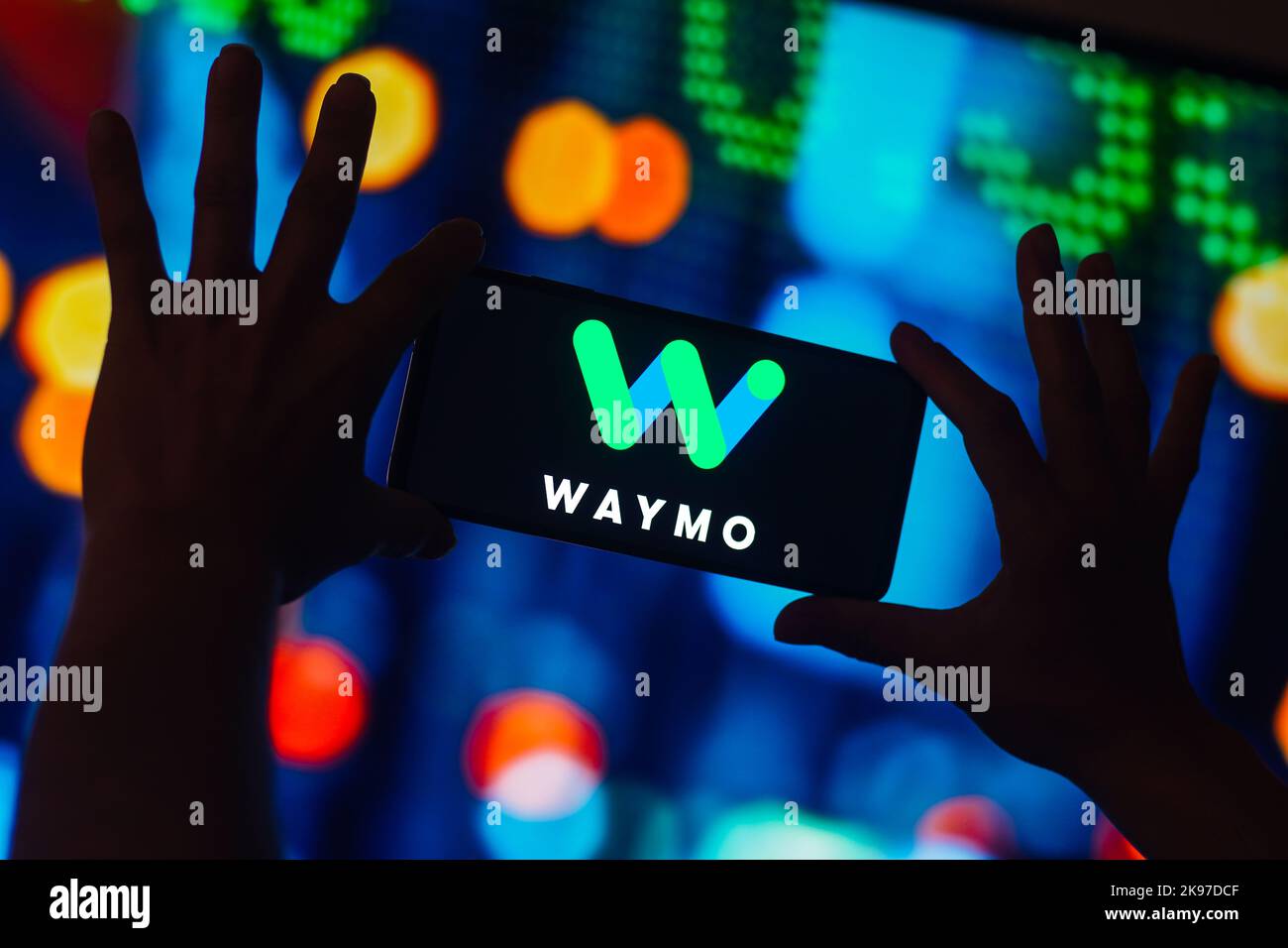 In this photo illustration, the Waymo logo is displayed on a smartphone ...