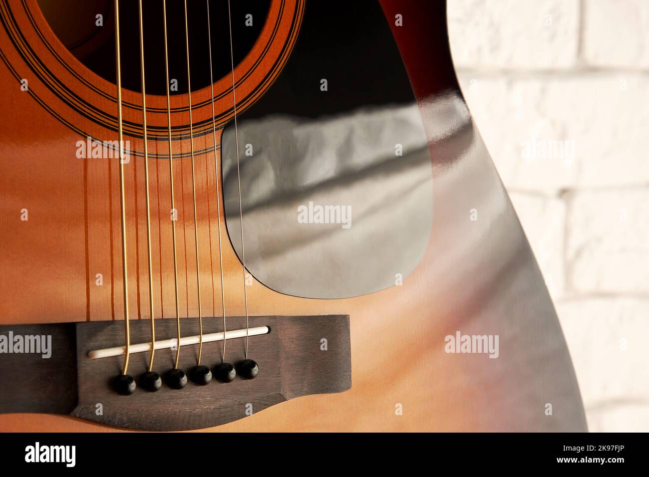 Close up front view of a traditional guitar neck and bridge with ...