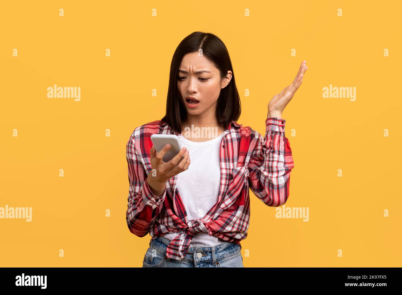 No WiFi. Disappointed chinese lady with smartphone suffering problems ...