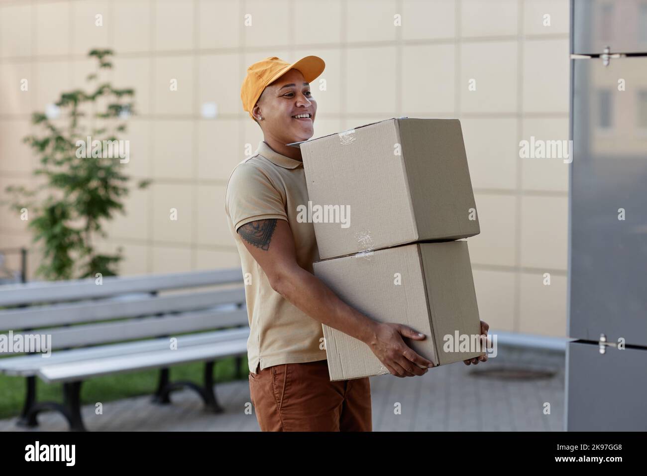 Female postal worker holding hi-res stock photography and images - Alamy