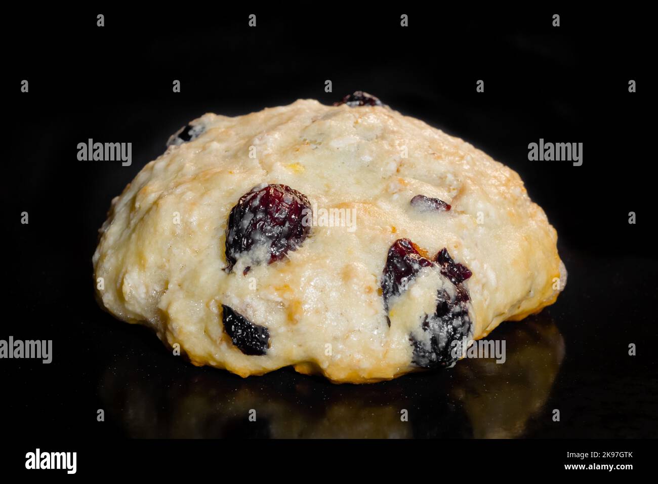 Cooking yellow crunchy oatmeal raisin cookie on metal sheet in oven ...