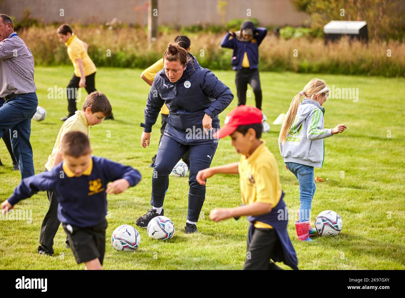 Mayfield Park Manchester, child playing football with MCFC in the ...