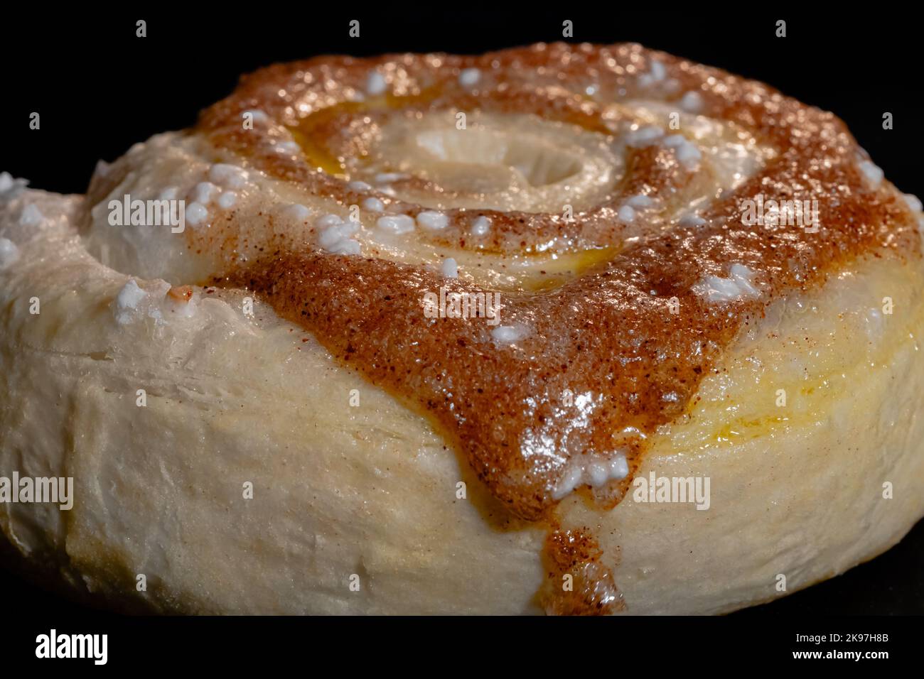 One cinnamon bun baking and rising in electric oven Stock Photo - Alamy