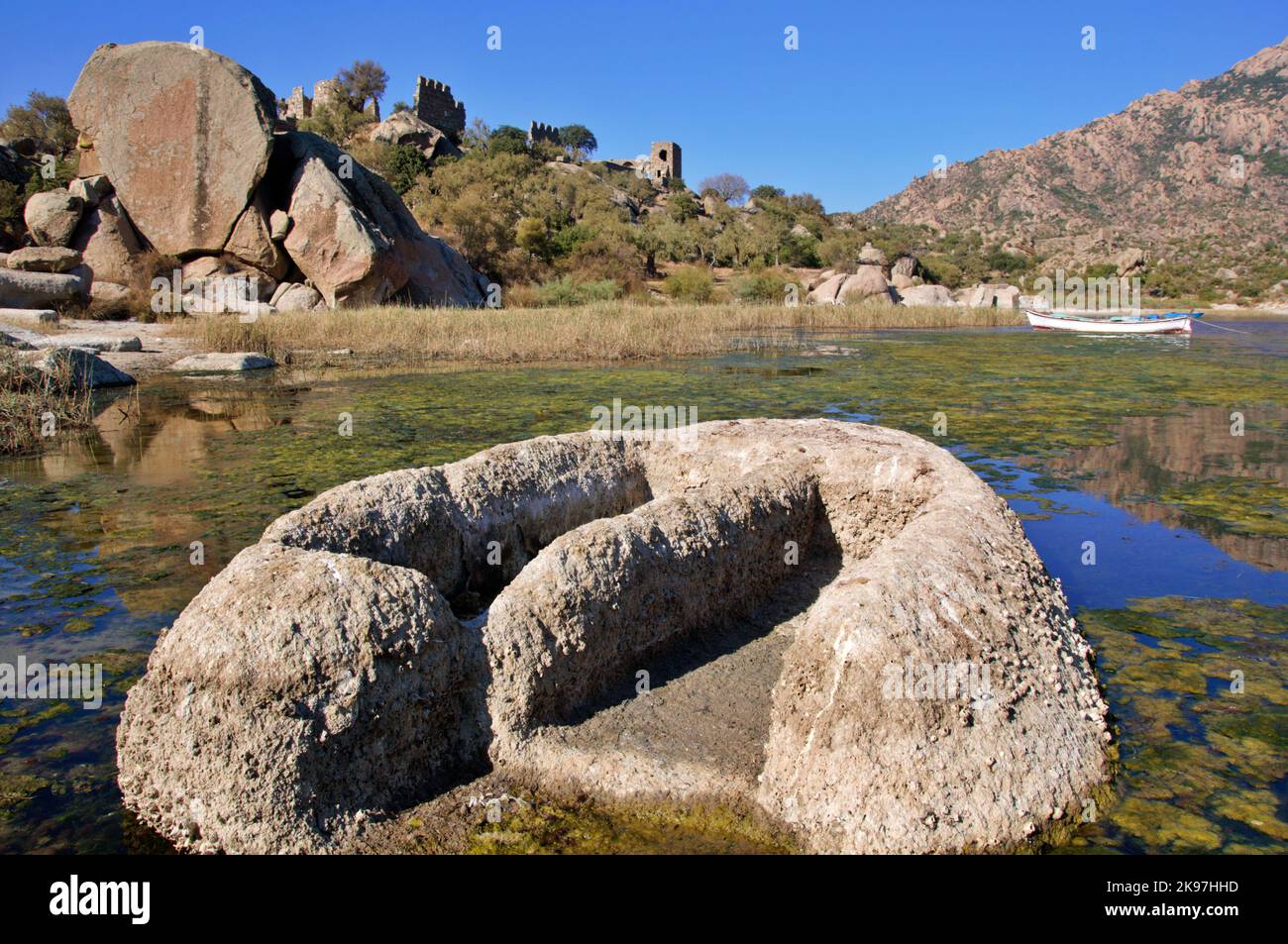 Landscape around Lake Bafa in Turkey, with ancient tombs near the water ...