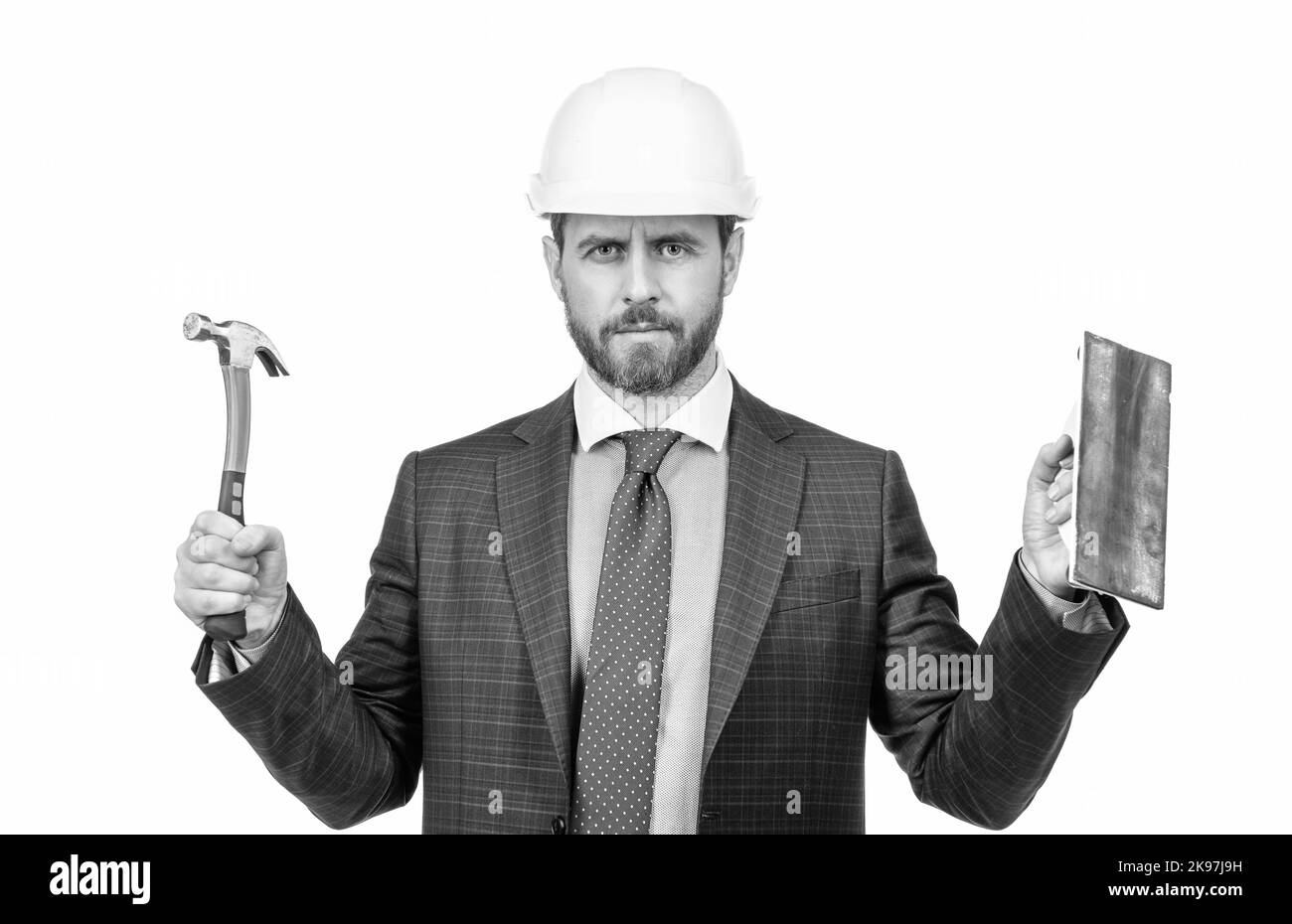 Building engineer wear safety helmet with formal suit holding hammer ...