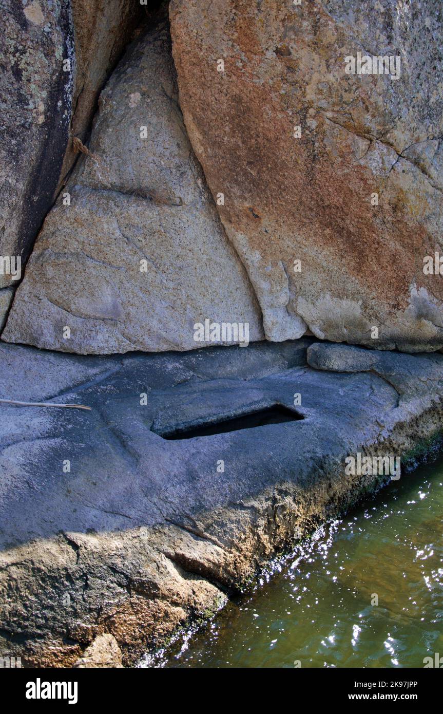 Landscape around Lake Bafa in Turkey, with ancient tombs near the water ...