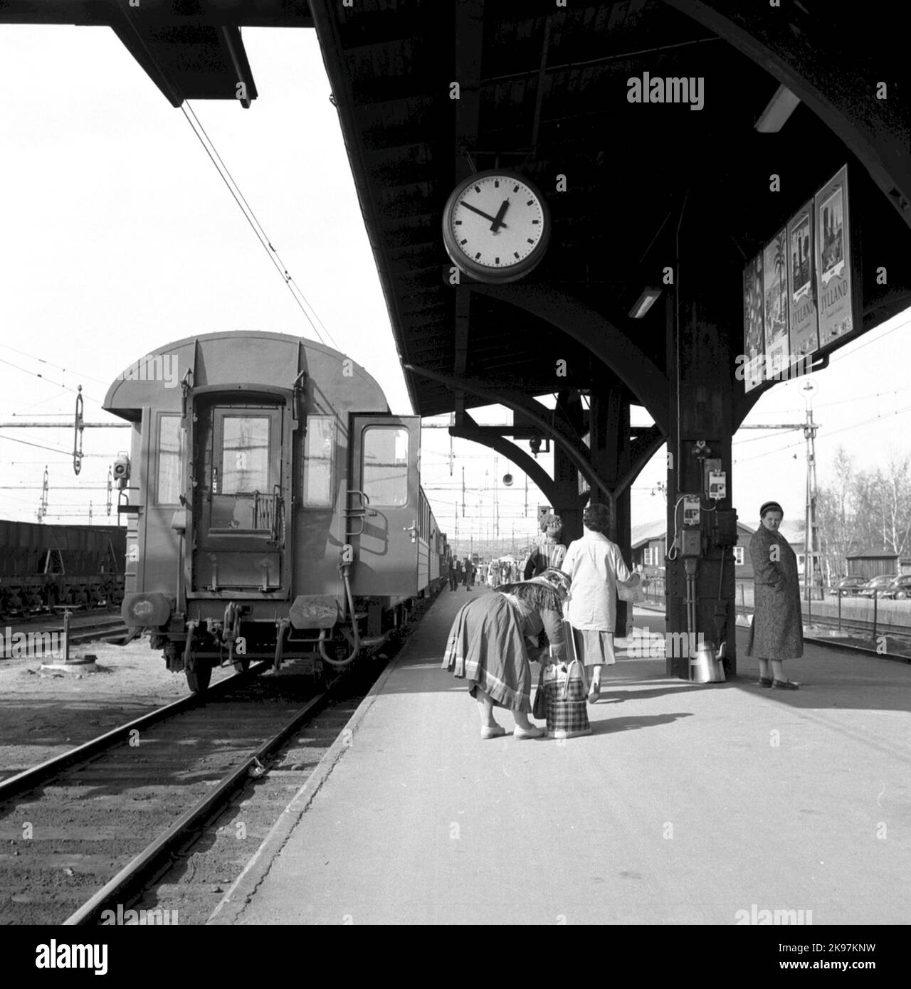 Travelers at the station Stock Photo - Alamy