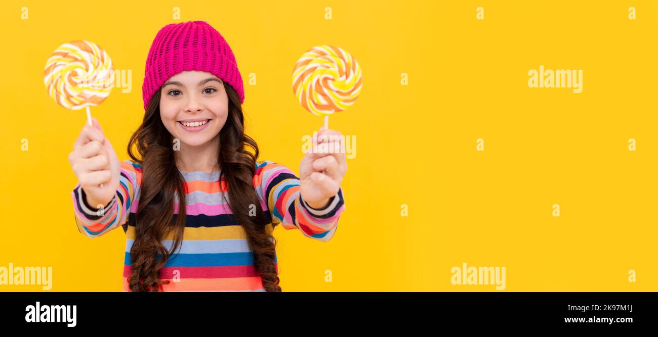 happy kid girl hold lollipop sweet, selective focus, candy shop ...