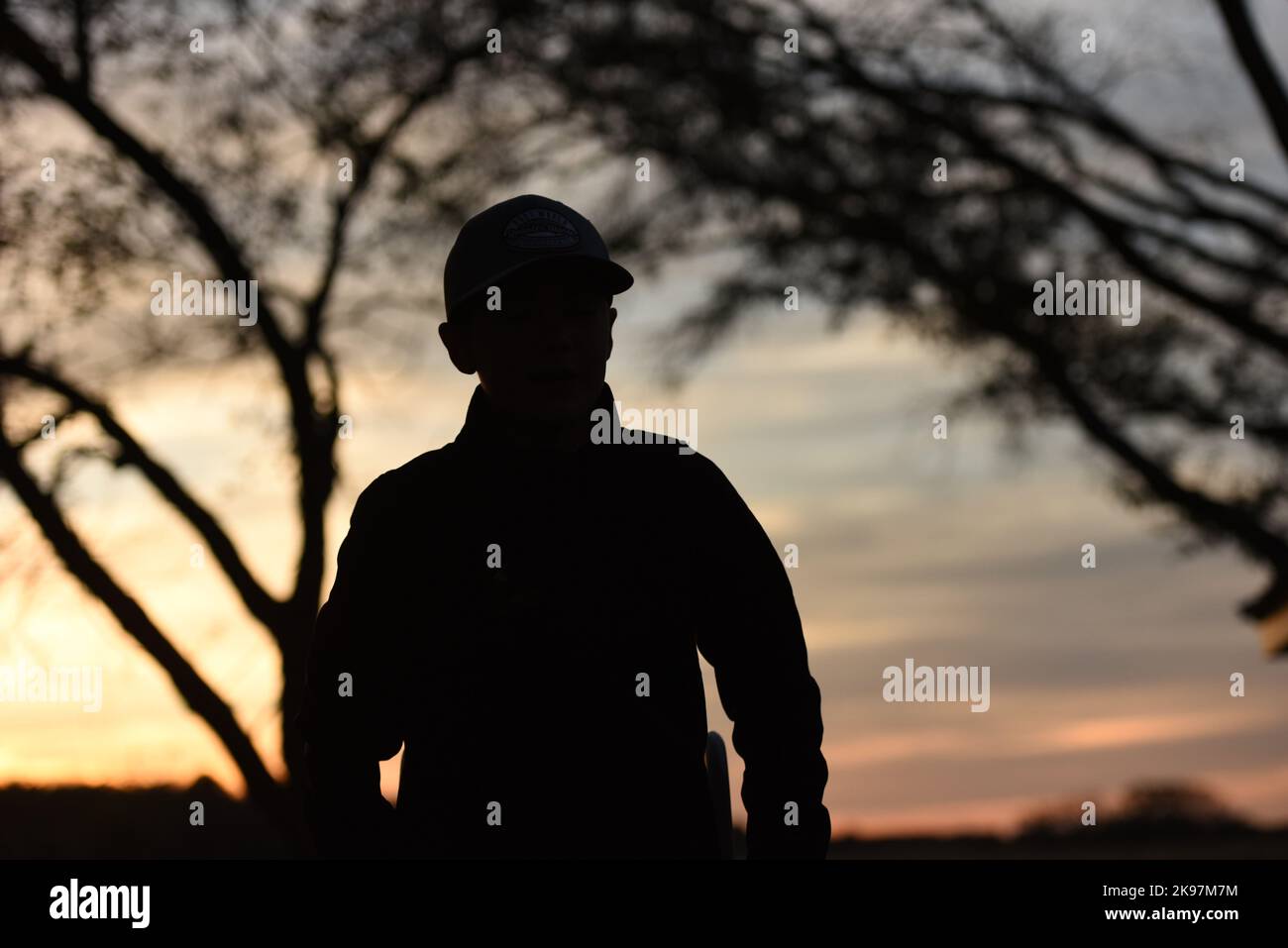 silhouette of person with sunset behind Stock Photo - Alamy