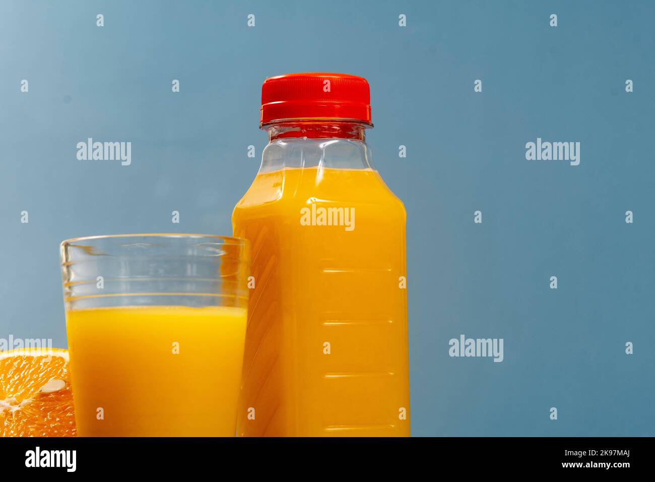 Natural orange juice in the glass with bottle on the side Stock Photo ...